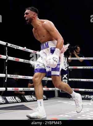 Adam Azim celebrates winning against Kurt Scoby at the Tottenham ...