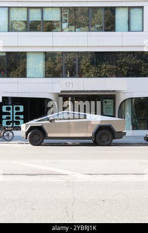 Side View of a Tesla Cybertruck in a Spacious Outdoor Parking Area ...