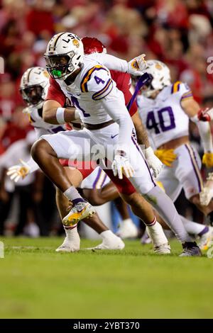 LSU defensive end Bradyn Swinson (13) follows a play during the second ...
