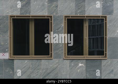 Two aluminium windows on stone wall, Symmetry Stock Photo - Alamy