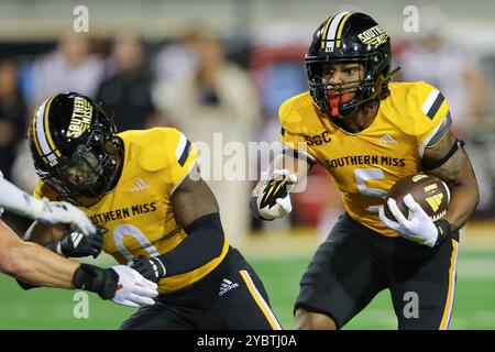 Arkansas State running back Kenyon Clay (5) is tackled by Kennesaw State defensive back Caleb ...