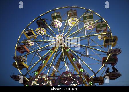 Photographic documentation of a Ferris wheel inside an amusement park ...
