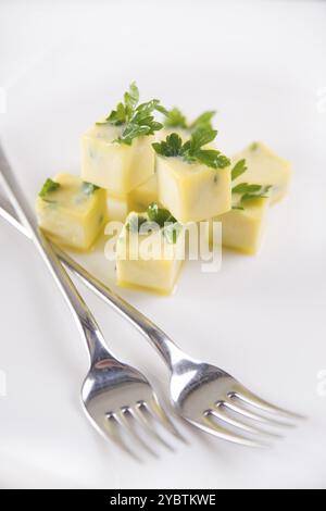 Frozen cubes of extra virgin olive oil flavored with parsley Stock ...