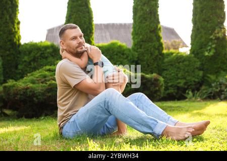 Father and daughter spending time in a spring park Stock Photo - Alamy