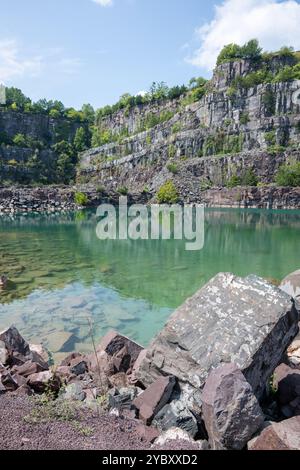 Layers of rock are seen from the interior of a rock quarry. Rock quarry ...