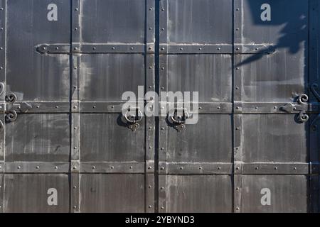 Iron, massive, old gates. Gate background Stock Photo - Alamy