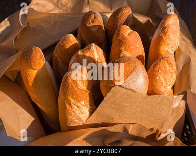 Freshly baked baguette on a light background Stock Photo - Alamy