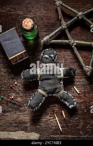 Scary voodoo doll burned with fire and pierced by a needle Stock Photo ...