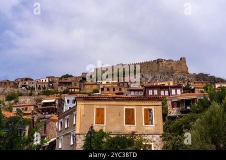 Medieval castle of Molyvos, Lesvos island, Greece and the Greek flag ...