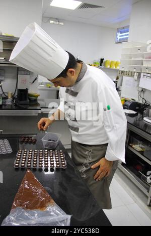 Maldives - March 07, 2014: Maldivian waiter walking in white suit ...