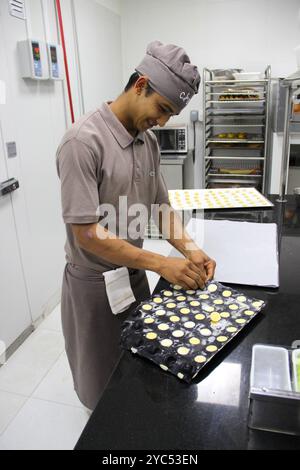Maldives - March 07, 2014: Maldivian waiter walking in white suit ...