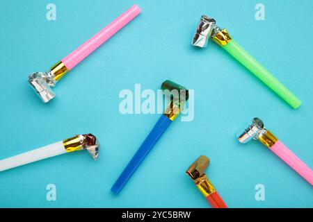 Party foil whistle or noise maker horn rolled isolated on the white ...