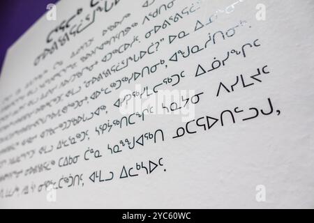 Text in the Inuktitut language displayed on a wall Stock Photo - Alamy