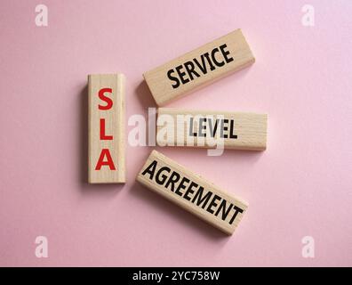 SLA - Service Level Agreement. Wooden cubes with word SLA. Beautiful ...
