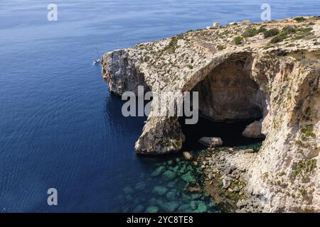The natural arch of the Blue Grotto photographed from the Blue Wall and ...