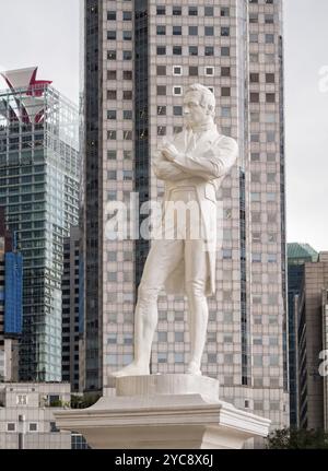 Bronze statue of Stamford Raffles, founder of modern Singapore, by Thomas Woolner in front of ...