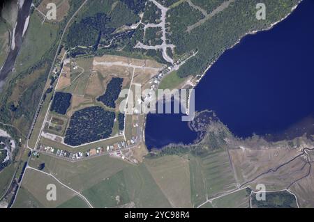 Aerial of Iveagh Bay housing development and Lake Brunner, West Coast ...