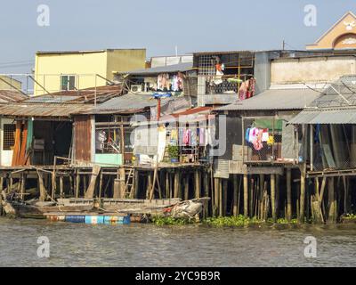 Shacks on stilts alog the Hau River in the Mekong Delta, Can Tho ...