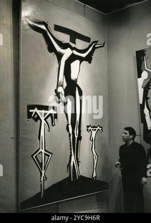 French artist Raymond Moretti with one of his paintings, 1965 Stock ...