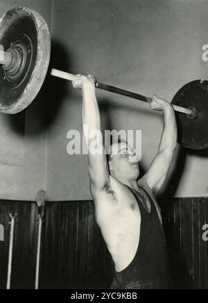 Weightlifter training, 1950s Stock Photo - Alamy