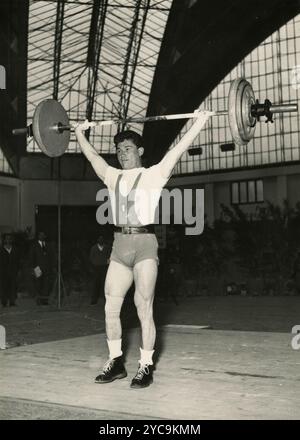 Italian weightlifter at a competition, Italy 1950s Stock Photo - Alamy