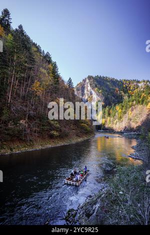 Raft with tourist on Dunajec river in autumn landscape of Pieniny ...
