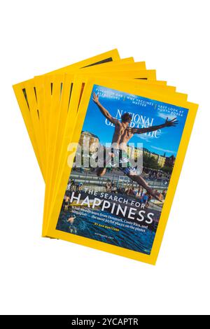 pile of National Geographic magazines isolated on white background ...