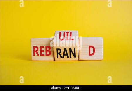 Rebuild and Rebrand symbol. Wooden cubes with words Rebrand and Rebuild ...