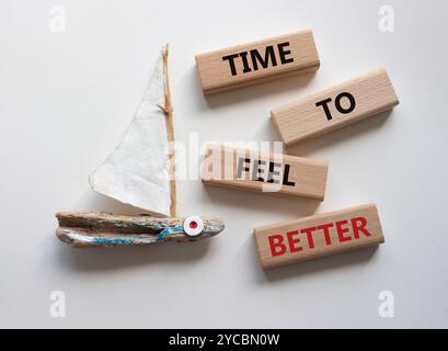 Time to feel better symbol. Wooden blocks with words Time to feel ...