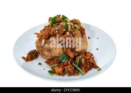A jacket potato filled with pulled pork Stock Photo - Alamy