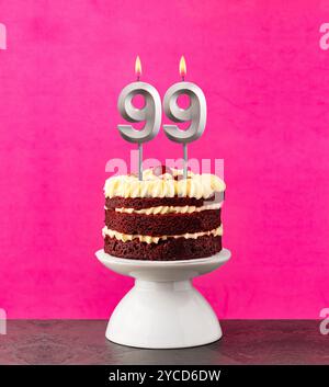 Pink number 99 birthday candle on white background Stock Photo - Alamy