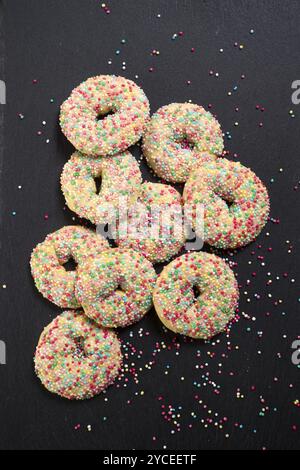 Prepared dry biscuits with sugar grains of different colors Stock Photo ...