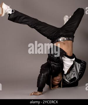 African american doing break dance on grey background Stock Photo - Alamy