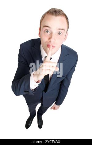 Business man hushing Stock Photo - Alamy