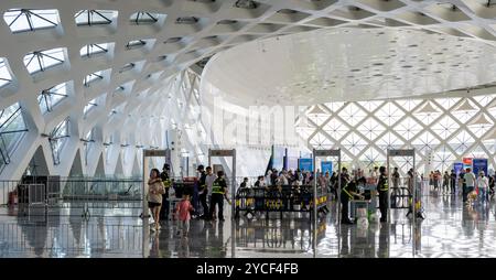 Haikou, China's Hainan Province. 2nd Aug, 2025. People watch a drone ...