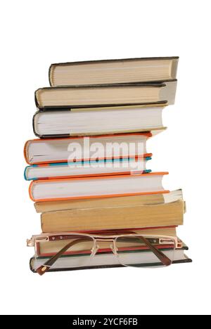 stack of books and glasses closeup on white background Stock Photo - Alamy