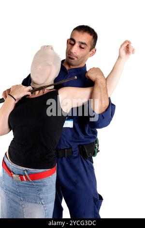 An officer apprehending a female Stock Photo - Alamy