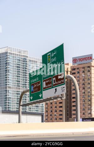 Directional road signs in Arabic and English in Dubai City, United Arab ...