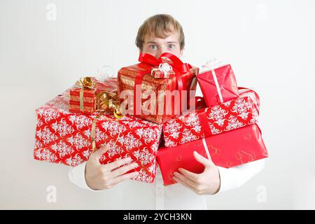 Presenting alot of gifts Stock Photo - Alamy