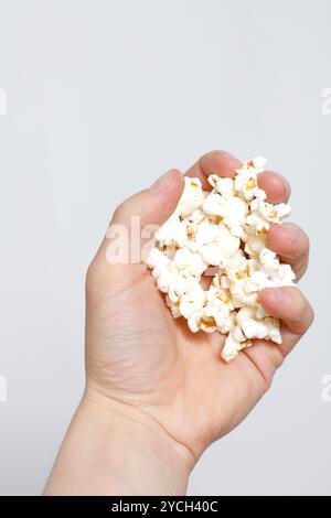 hand picking a tasty popcorn Stock Photo - Alamy