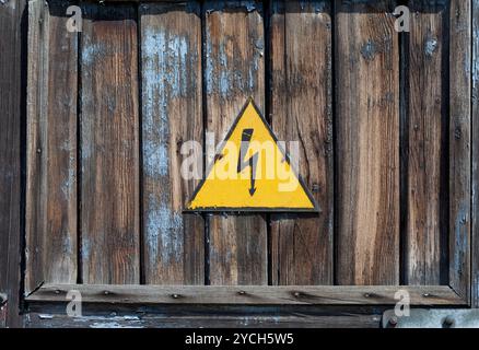 Sign with warning high voltage an old rusty metal surface Stock Photo ...