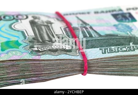 Russian rubles wrapped by rubber on white background Stock Photo - Alamy