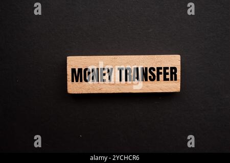 Wooden block with symbol of money transfer concept Stock Photo - Alamy