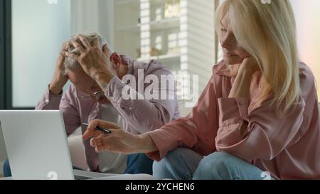 Stressed senior couple in debt at home Stock Photo - Alamy