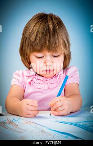 Little baby girl draws pencil Stock Photo - Alamy