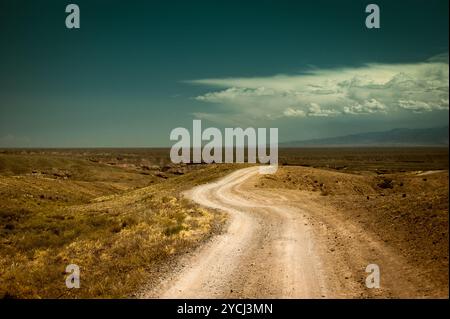 rural road going through prairie under sunset sky Stock Photo - Alamy