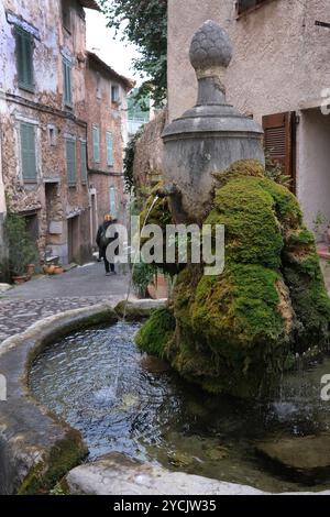 One of the many water fountains in the French village of Bargemon in ...