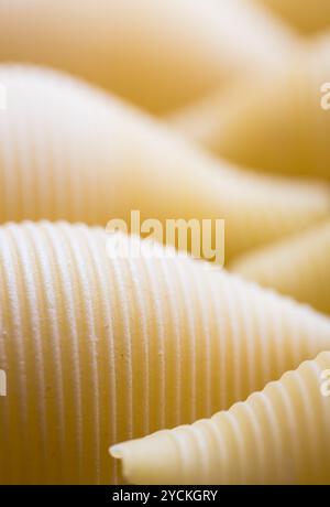 Ribbed dry yellow macaroni with periodic line Stock Photo - Alamy