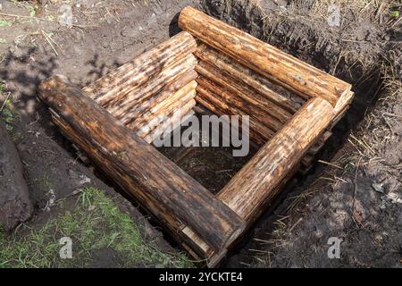 Construction of wooden water well in countryside Stock Photo - Alamy