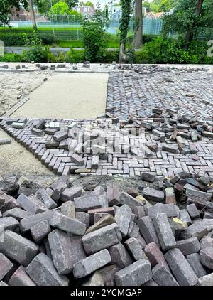 Process of laying paving stone blocks outdoors Stock Photo - Alamy